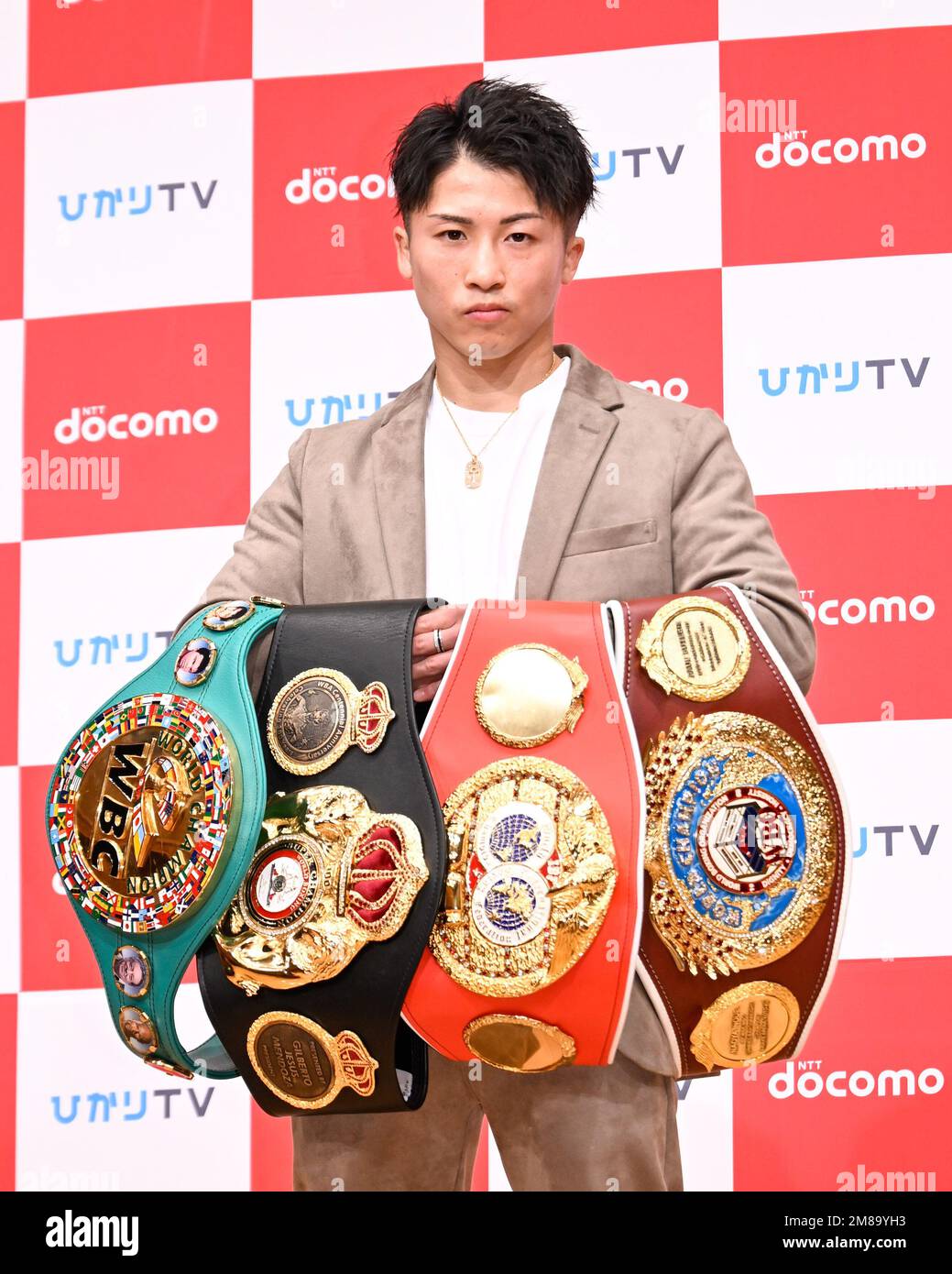Boxer Naoya Inoue of Japan poses for photographs during a press ...