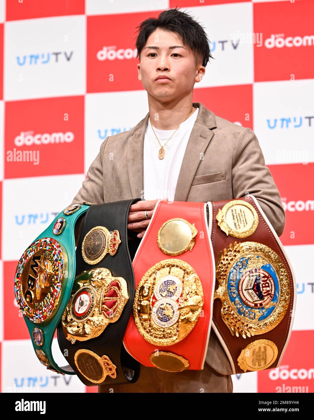 Boxer Naoya Inoue of Japan poses for photographs during a press ...