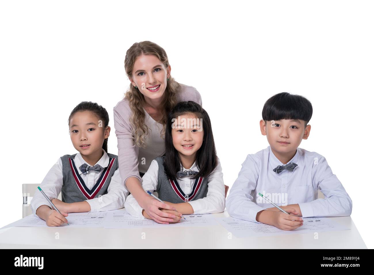 Female teachers guide students learning Stock Photo - Alamy