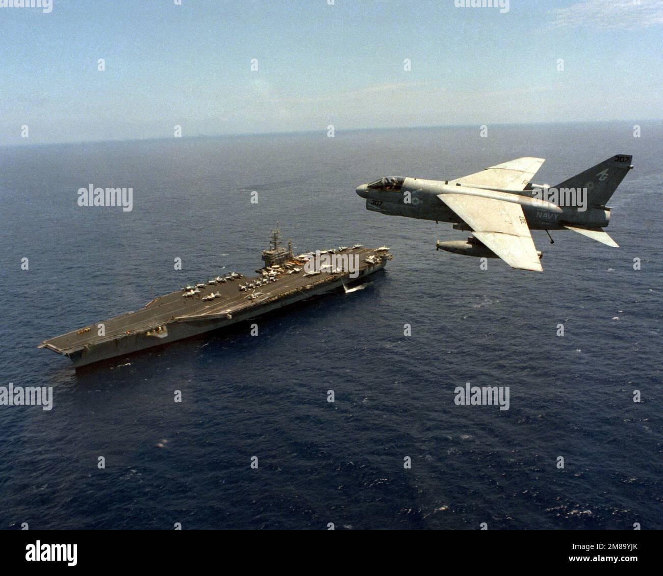 An A-7E Corsair aircraft from Attack Squadron 46 (VA-46) passes near ...
