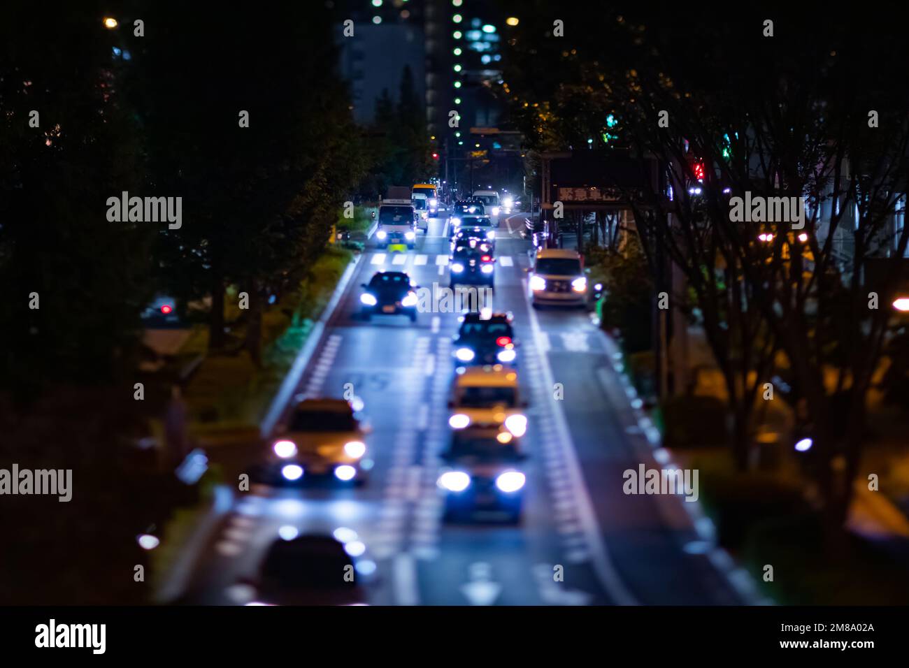 A night timelapse miniature traffic jam at the city crossing in Tokyo ...