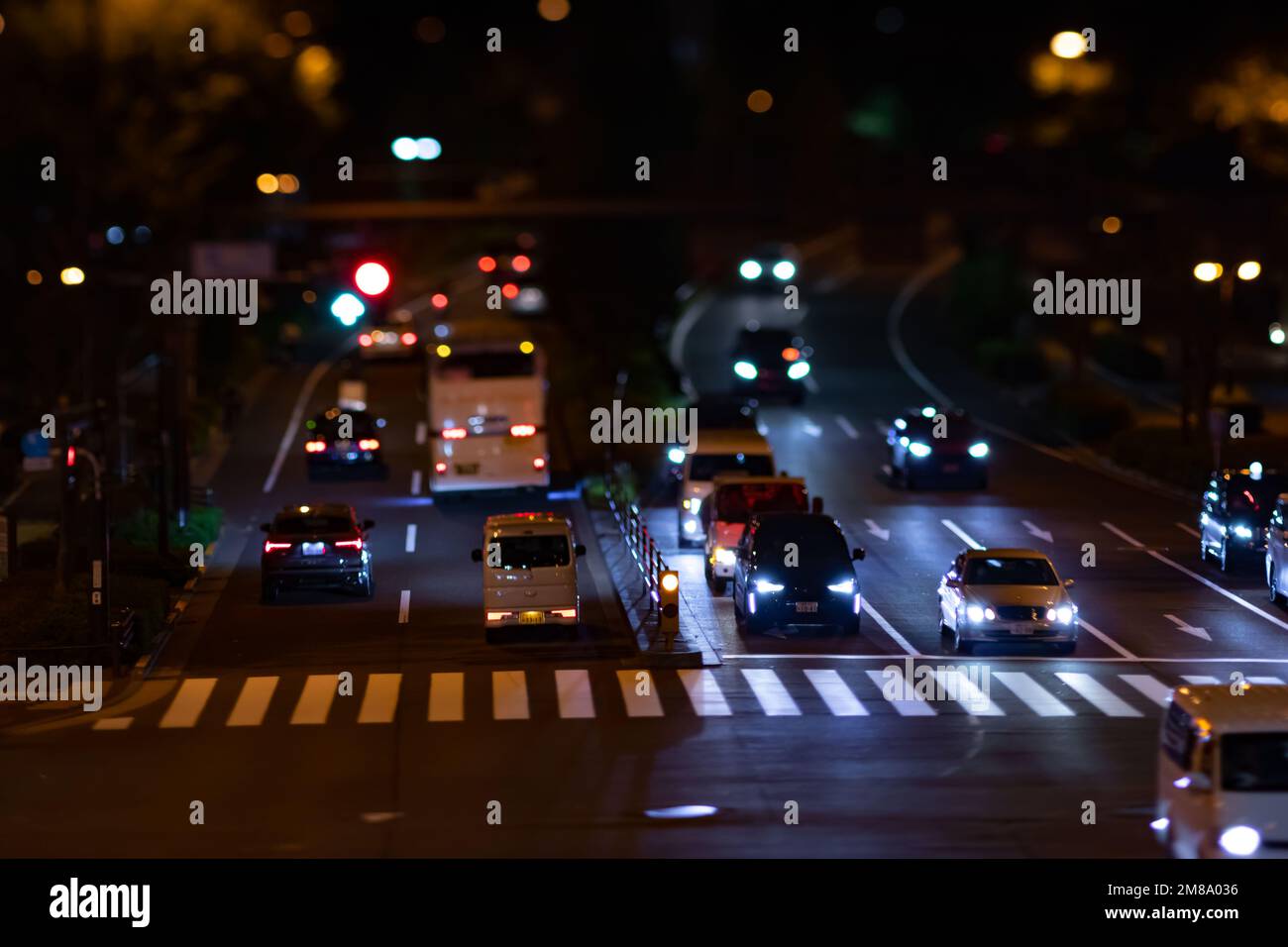 A night timelapse miniature traffic jam at the city crossing in Tokyo ...