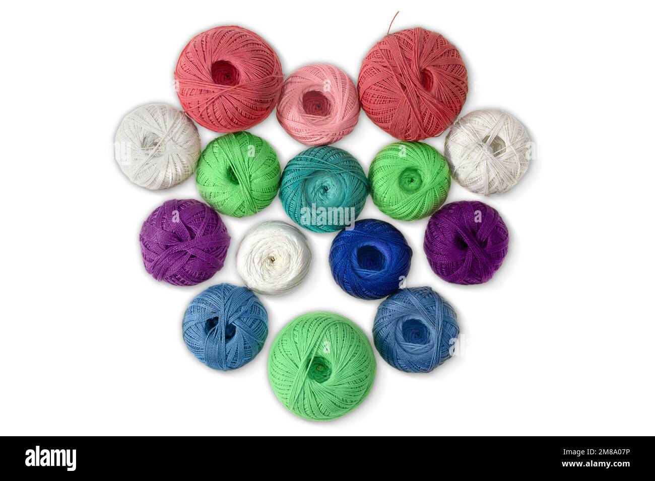 Multi-colored wool balls, yarn in shape of heart on white isolated ...