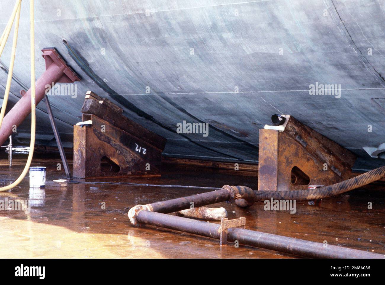 A close-up view of supports anchoring the guided missile frigate USS ...