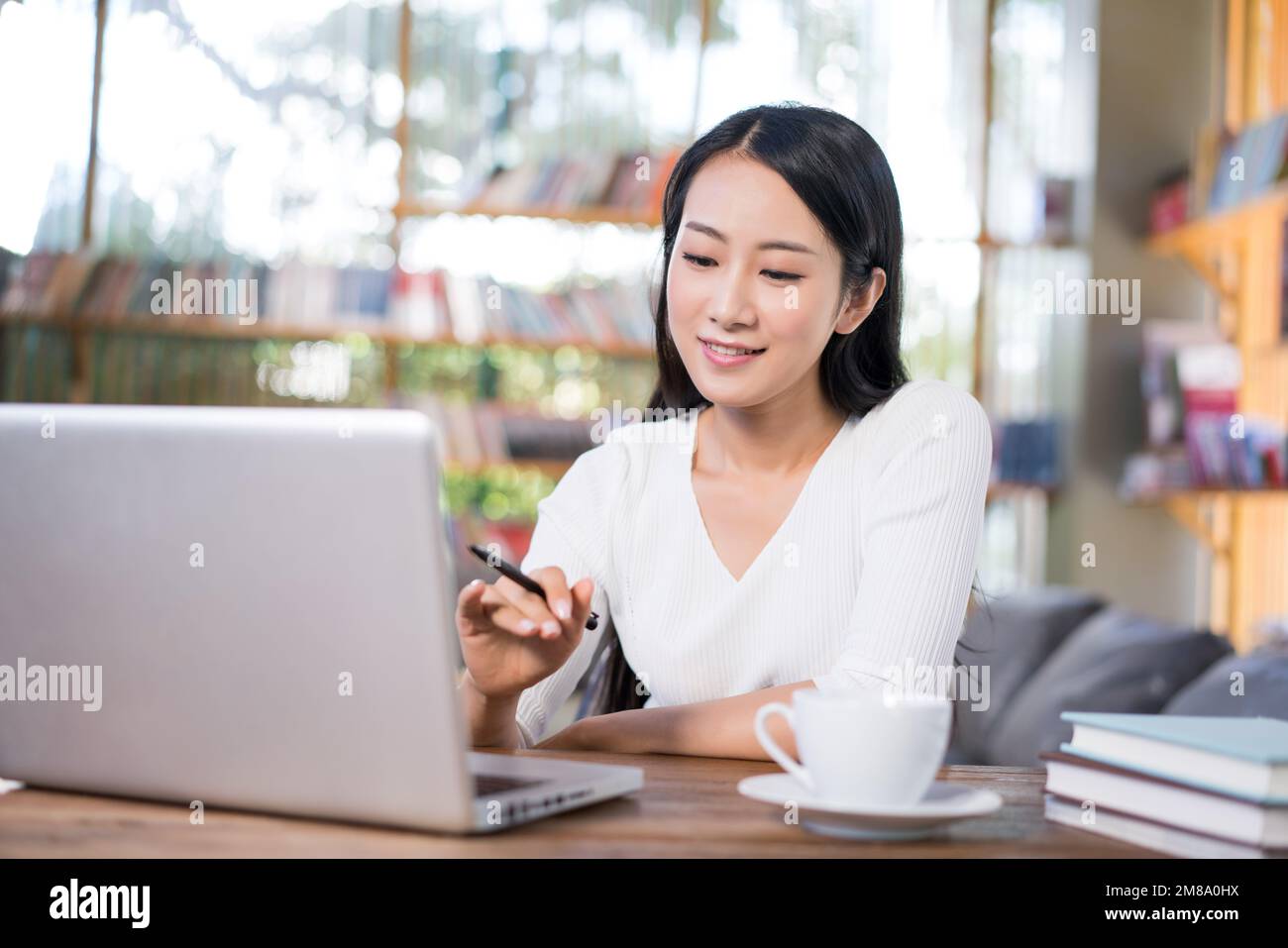 A young woman use the computer Stock Photo - Alamy