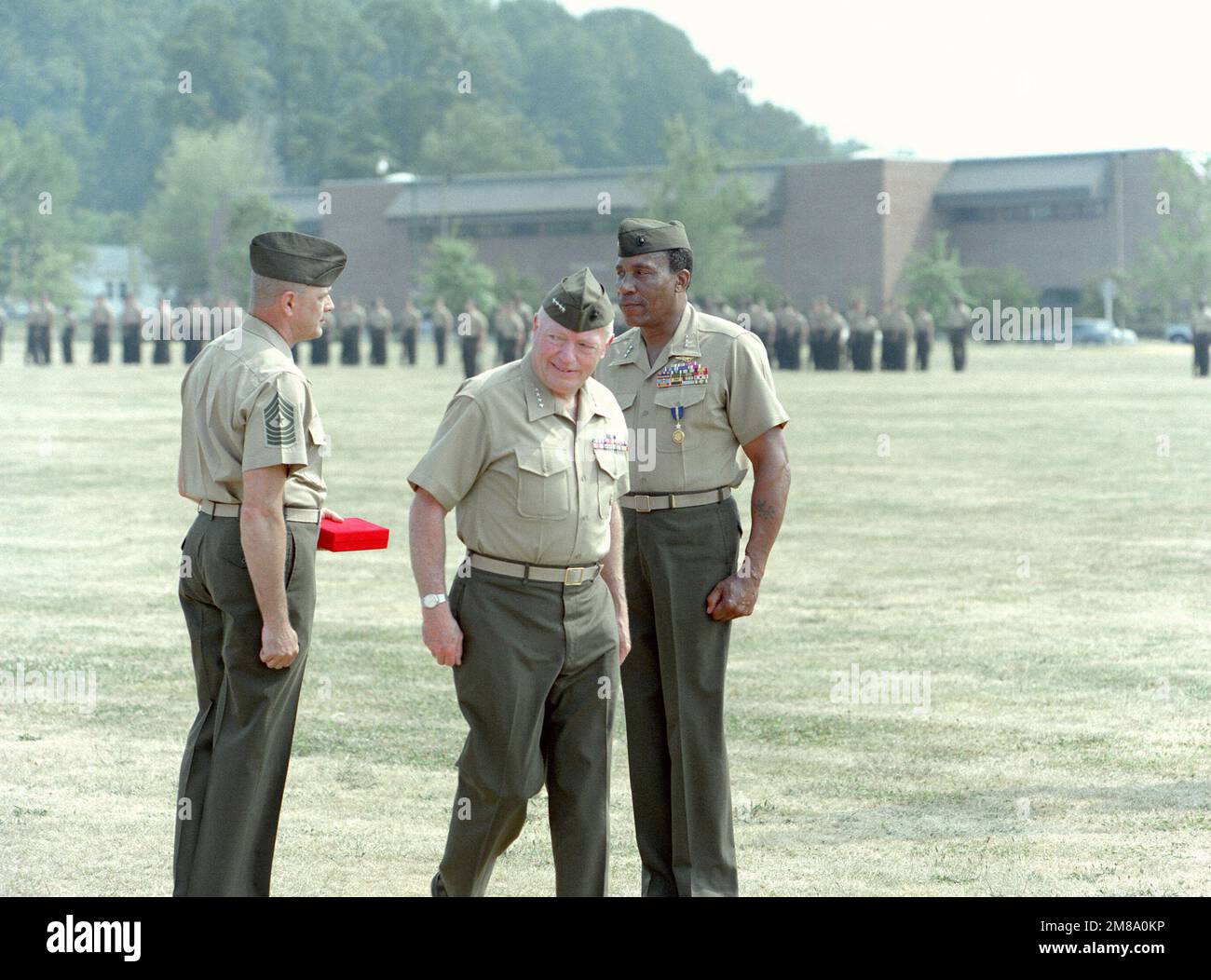 GEN Alfred M. Gray Jr., commandant of the Marine Corps, prepares to present the Meritorious ...