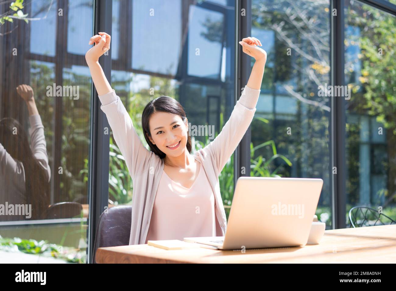 A young woman use the computer Stock Photo - Alamy