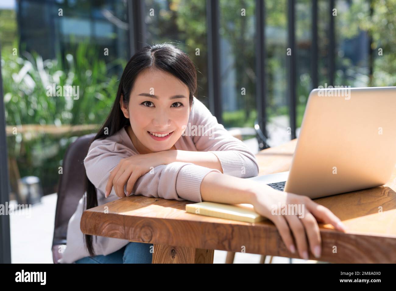 A young woman use the computer Stock Photo - Alamy
