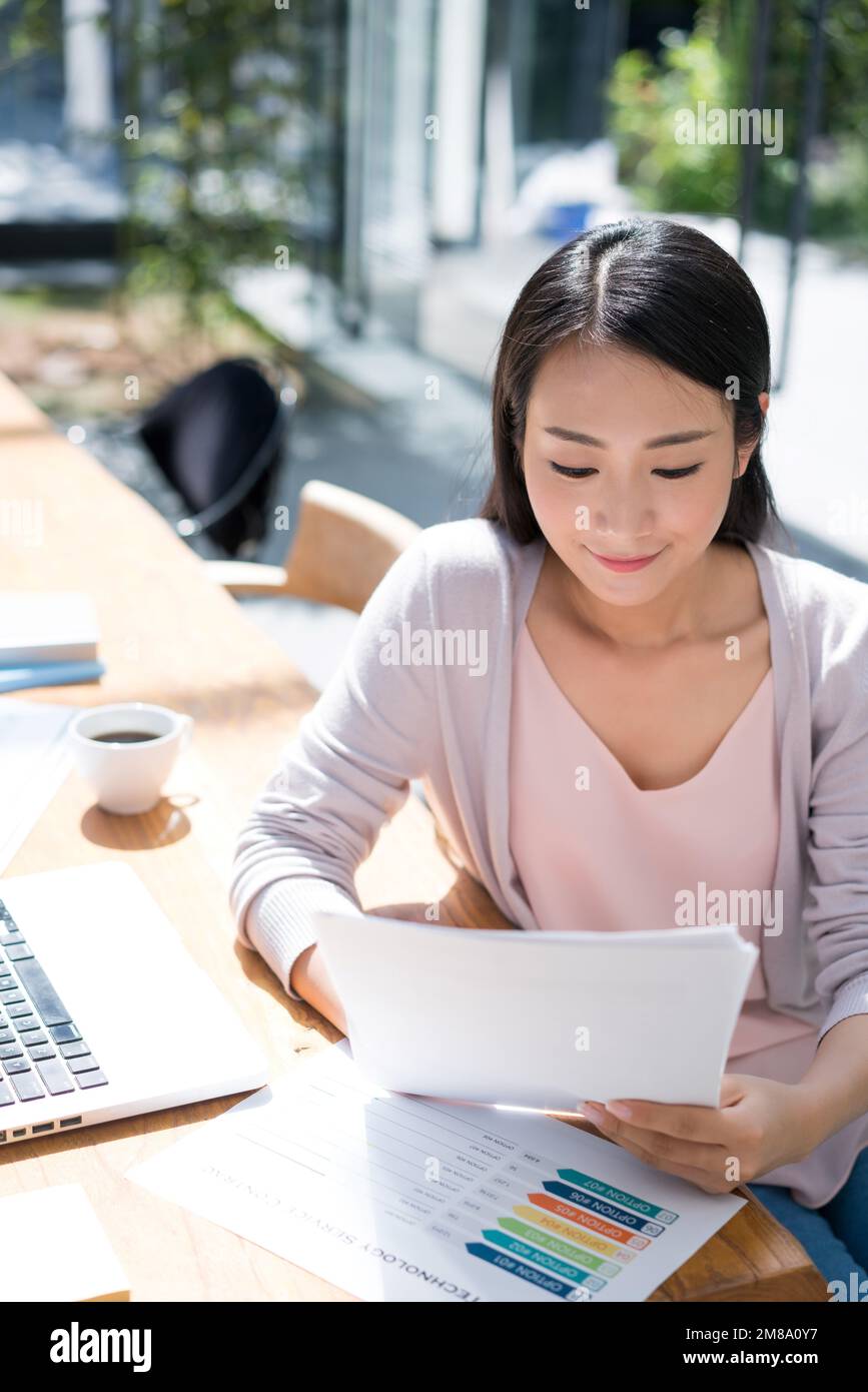 A young woman use the computer Stock Photo - Alamy