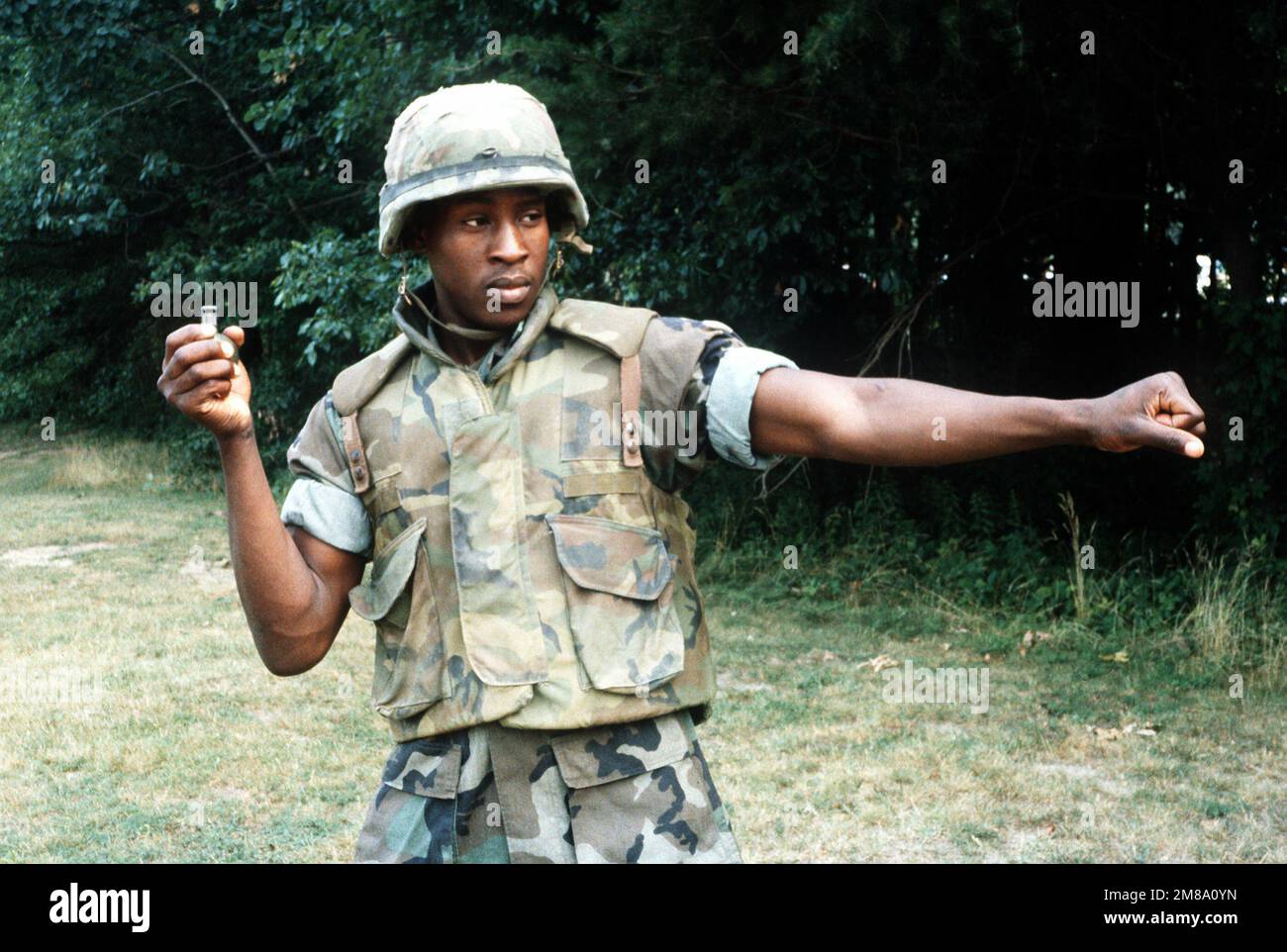 PFC. White, Tactical Platoon, The Basic School, demonstrates the proper ...