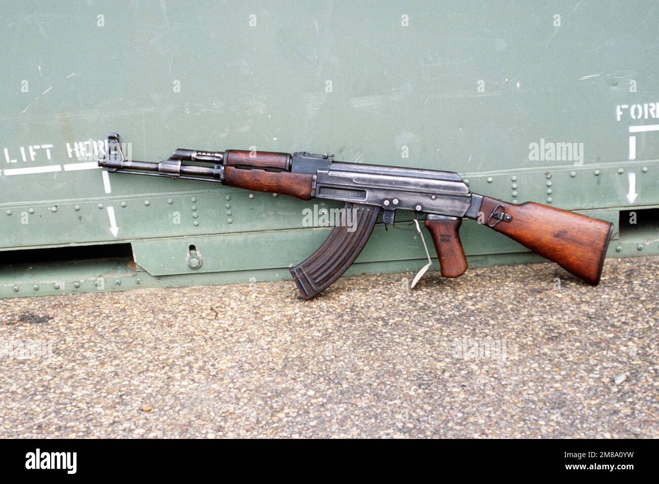 A close-up view of a Soviet 7.62mm AK-47 assault rifle on display. Base ...