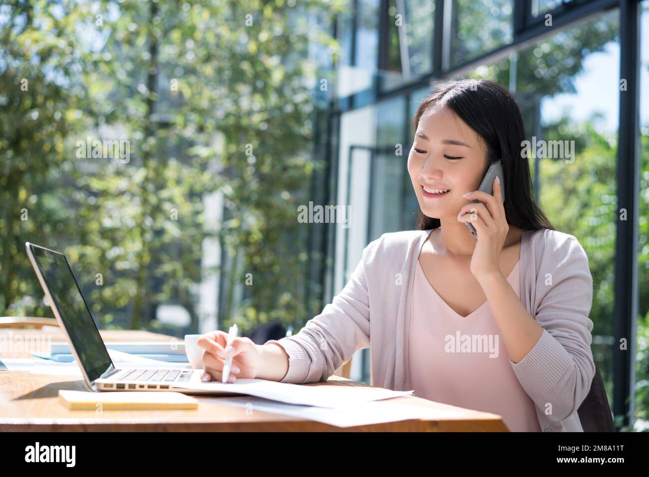 A young woman use the computer Stock Photo - Alamy