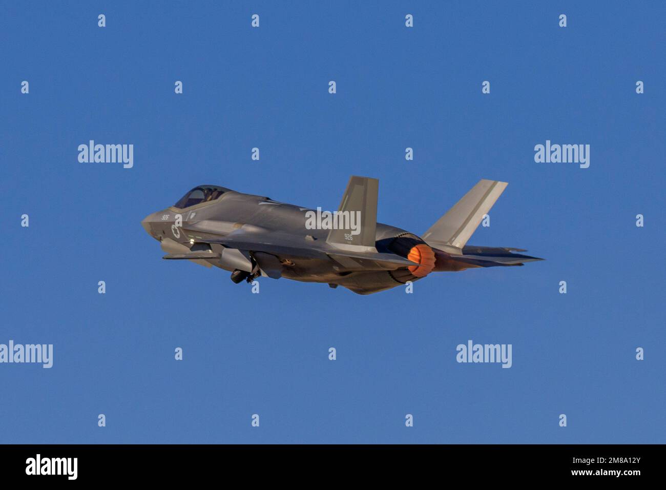 A fighter during fight in background of blue sky Stock Photo - Alamy