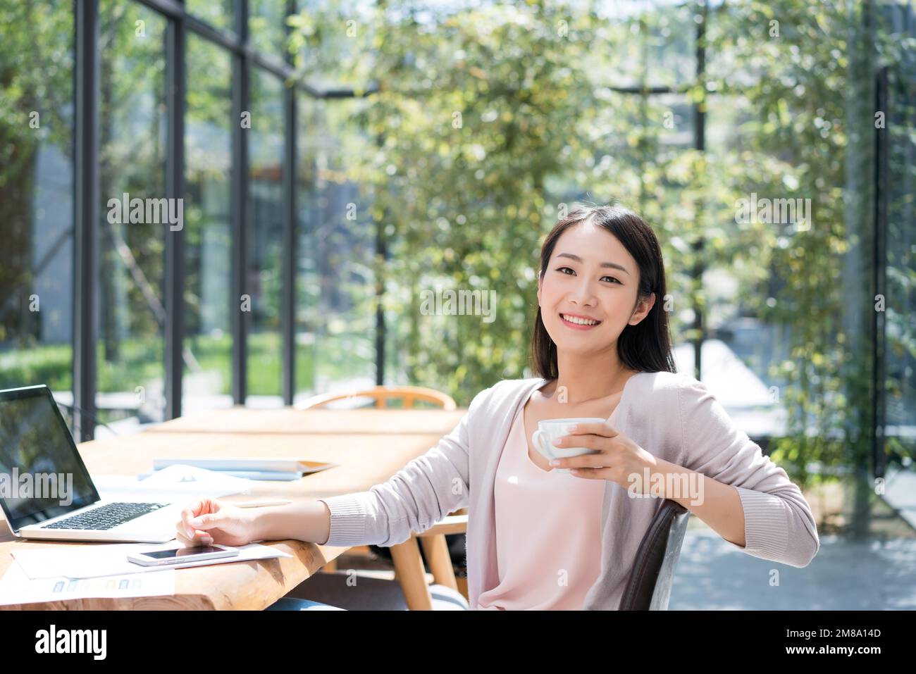 A young woman use the computer Stock Photo - Alamy