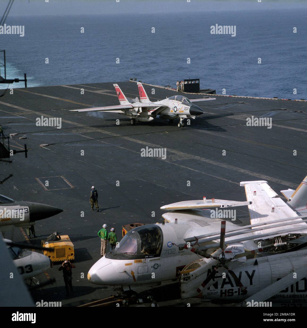 A fighter Squadron 31 (VF-31) F-14A Tomcat aircraft lands on the ...