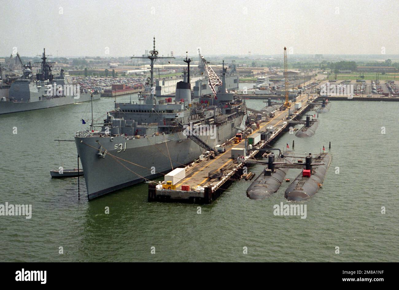 A group of submarines lie moored at Pier 23 along with the submarine ...