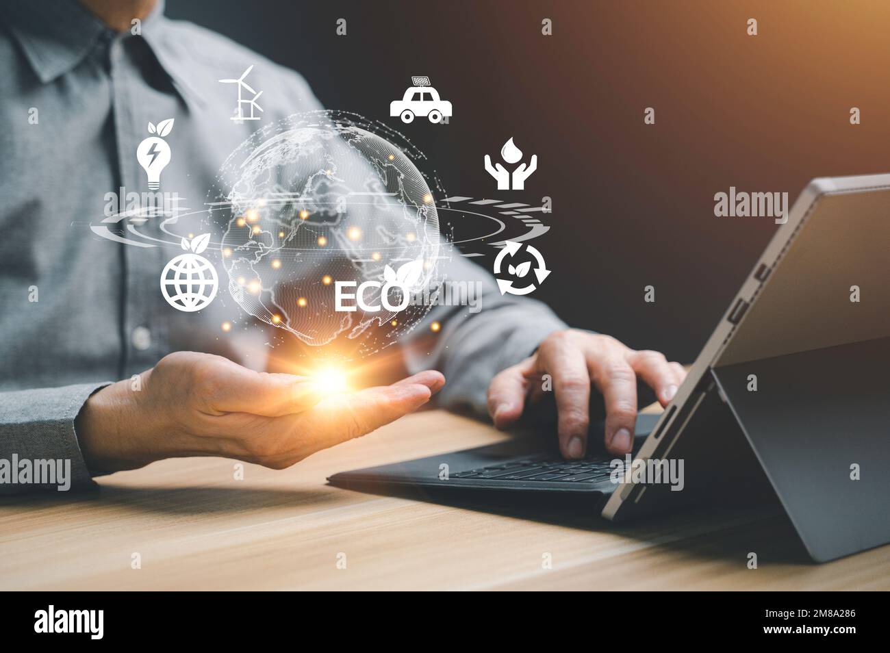 Businessman holding ECO global network connection metaverse. Green ...