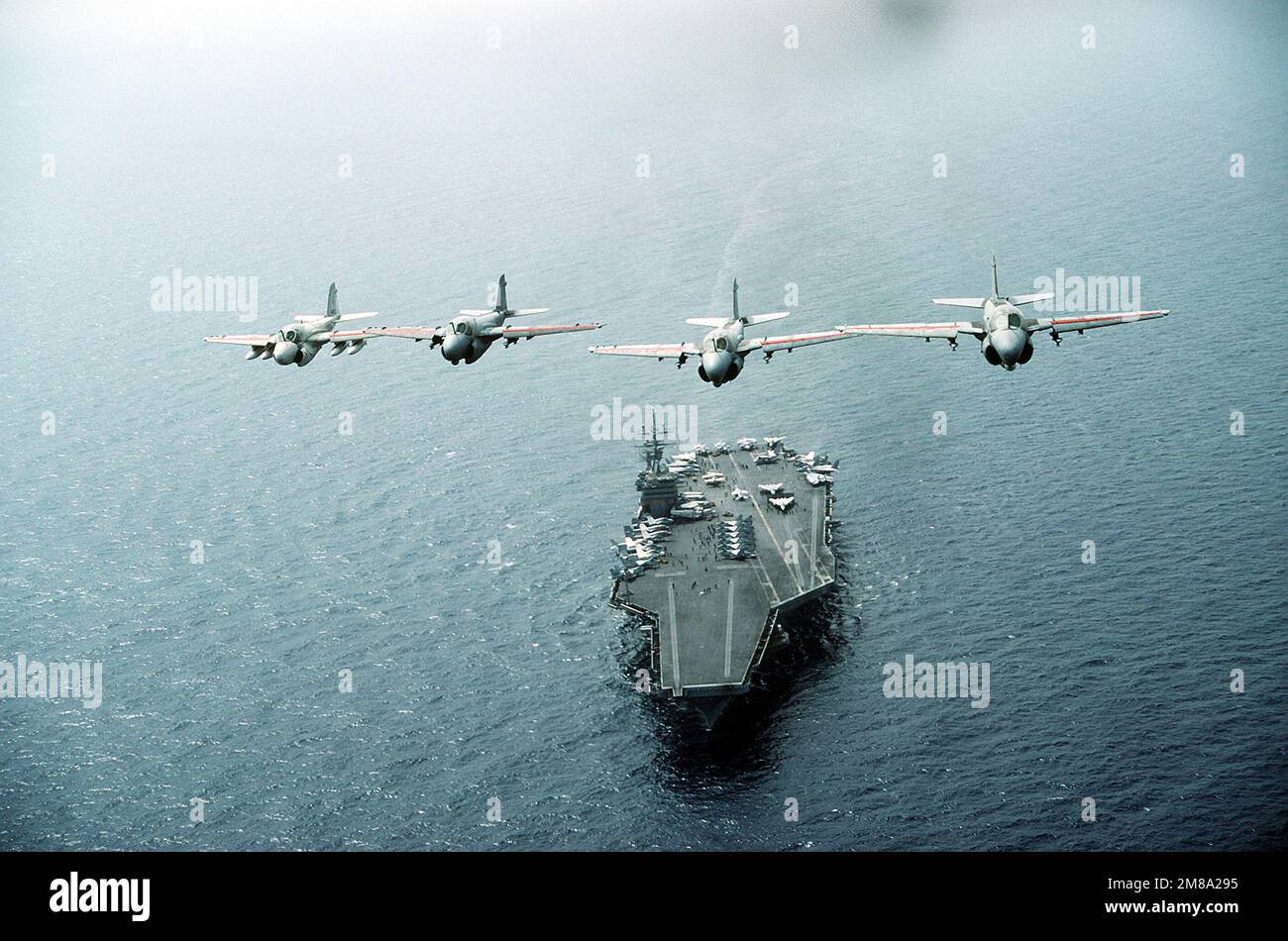 An air-to-air front view of a flight of one KA-6D Intruder and three A ...