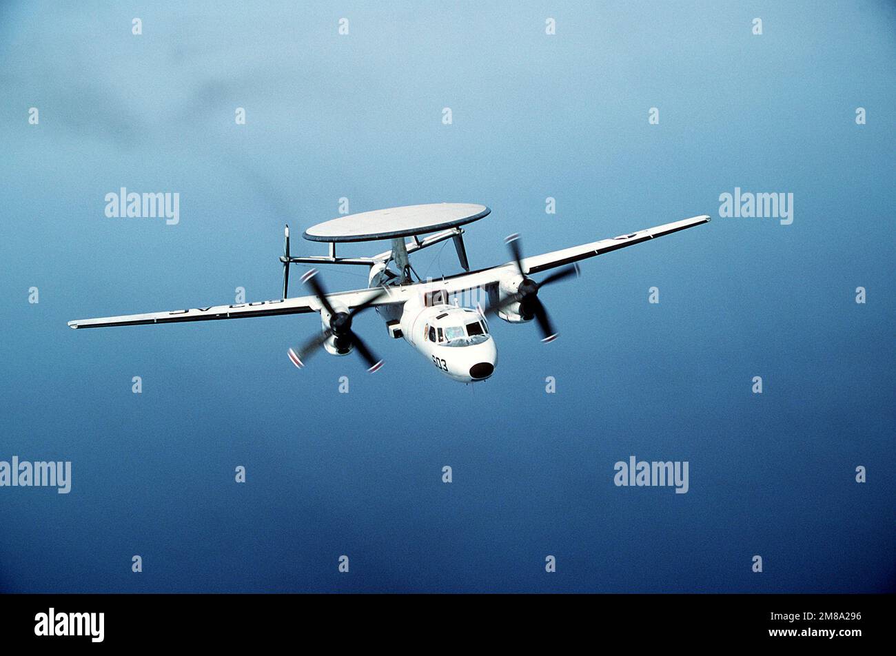 An air-to-air right front view of an E-2C Hawkeye aircraft from Carrier ...