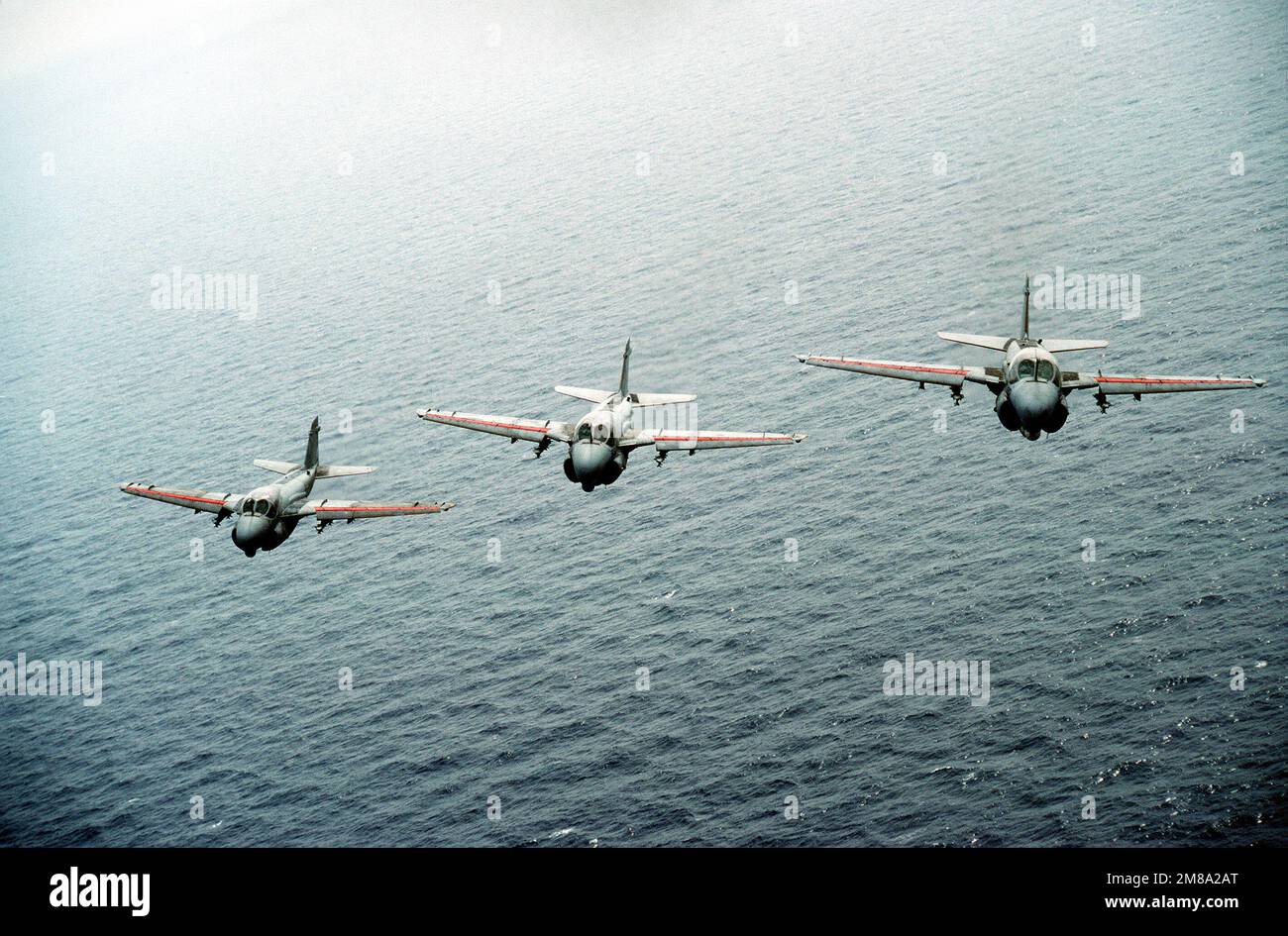 An air-to-air front view of three A-6E Intruder aircraft from Attack ...