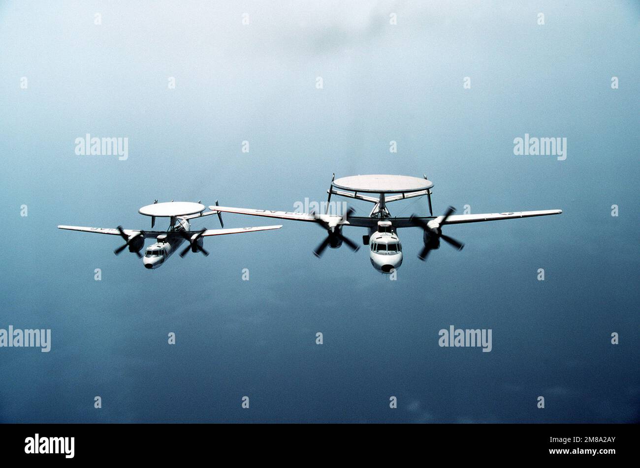 An air-to-air left front view of two E-2C Hawkeye aircraft from Carrier ...