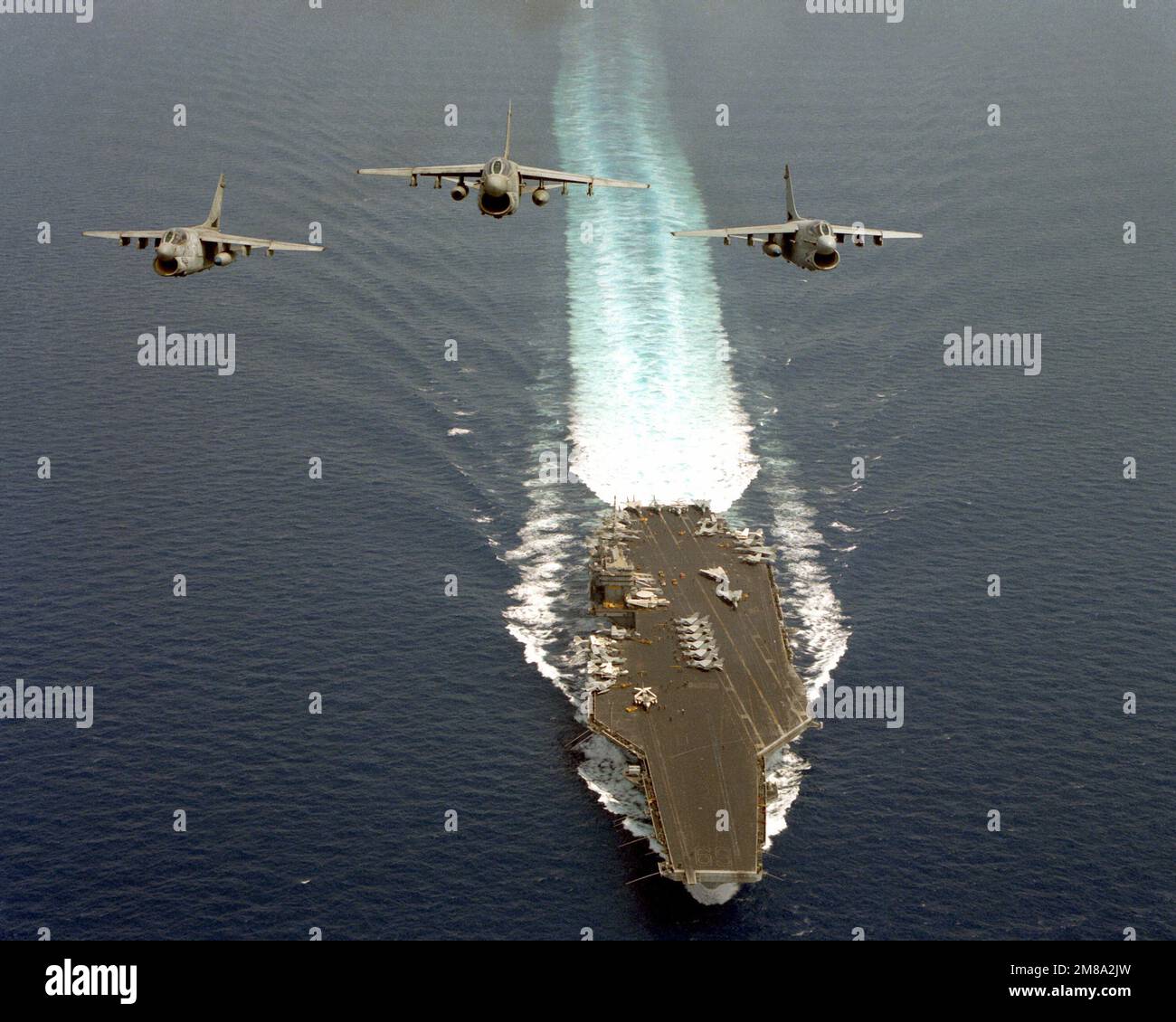 An air-to-air front view of three A-7E Corsair II aircraft in formation ...