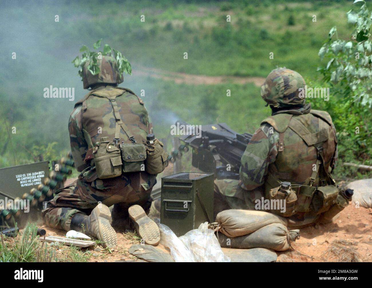 Marines fire a Mark 19 40mm grenade launcher during a combined arms ...