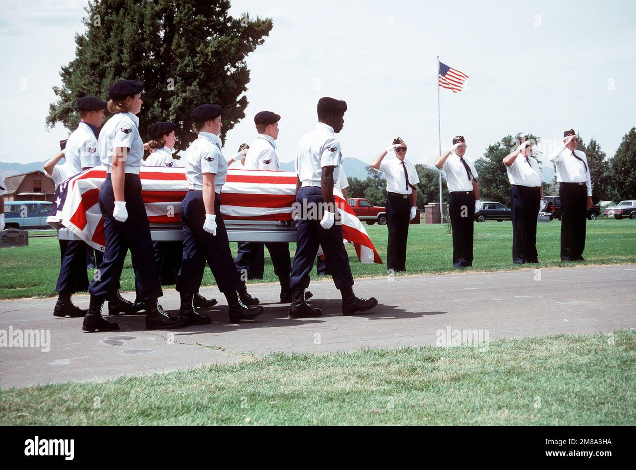 An honor guard from Hill Air Force Base carries the casket at the ...