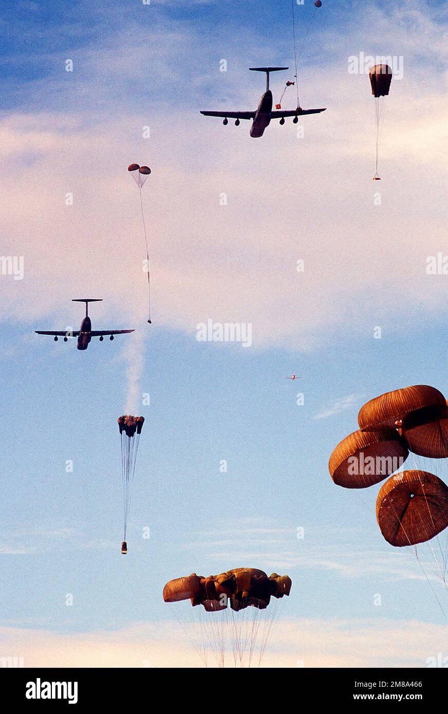 Four M-551 Sheridan light tanks are dropped from the rear of a 436th ...