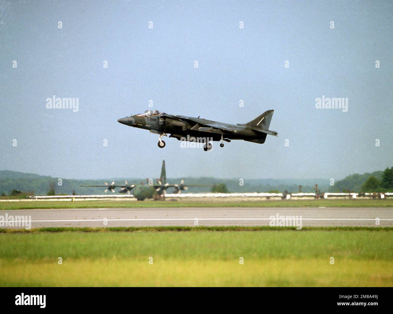 An AV-8B Harrier aircraft performs a vertical takeoff during Airshow ...
