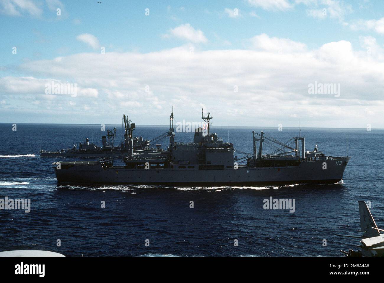 A starboard beam view of the amphibious cargo ship USS CHARLESTON (LKA ...