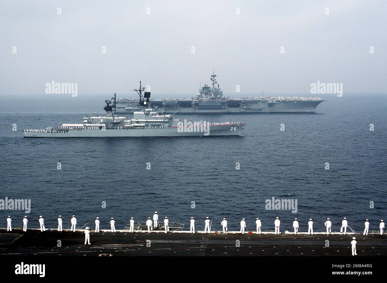 Crew members man the rails of the 6th Fleet flagship USS BELKNAP (CG-26 ...
