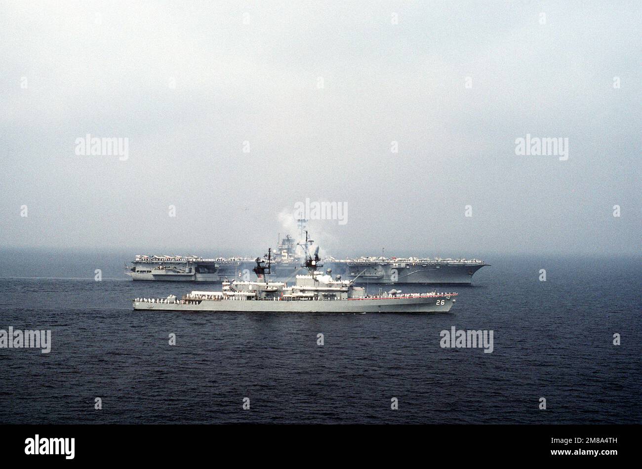 Crew members man the rails of the 6th Fleet flagship USS BELKNAP (CG-26 ...