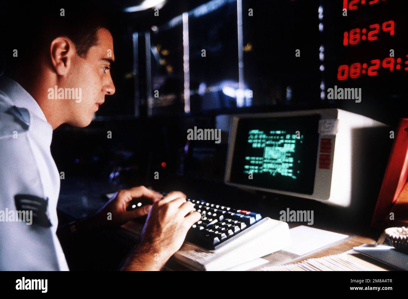 SGT. Steven Choinier logs 1957th Information Systems Group maintenance data into a computer. The ...