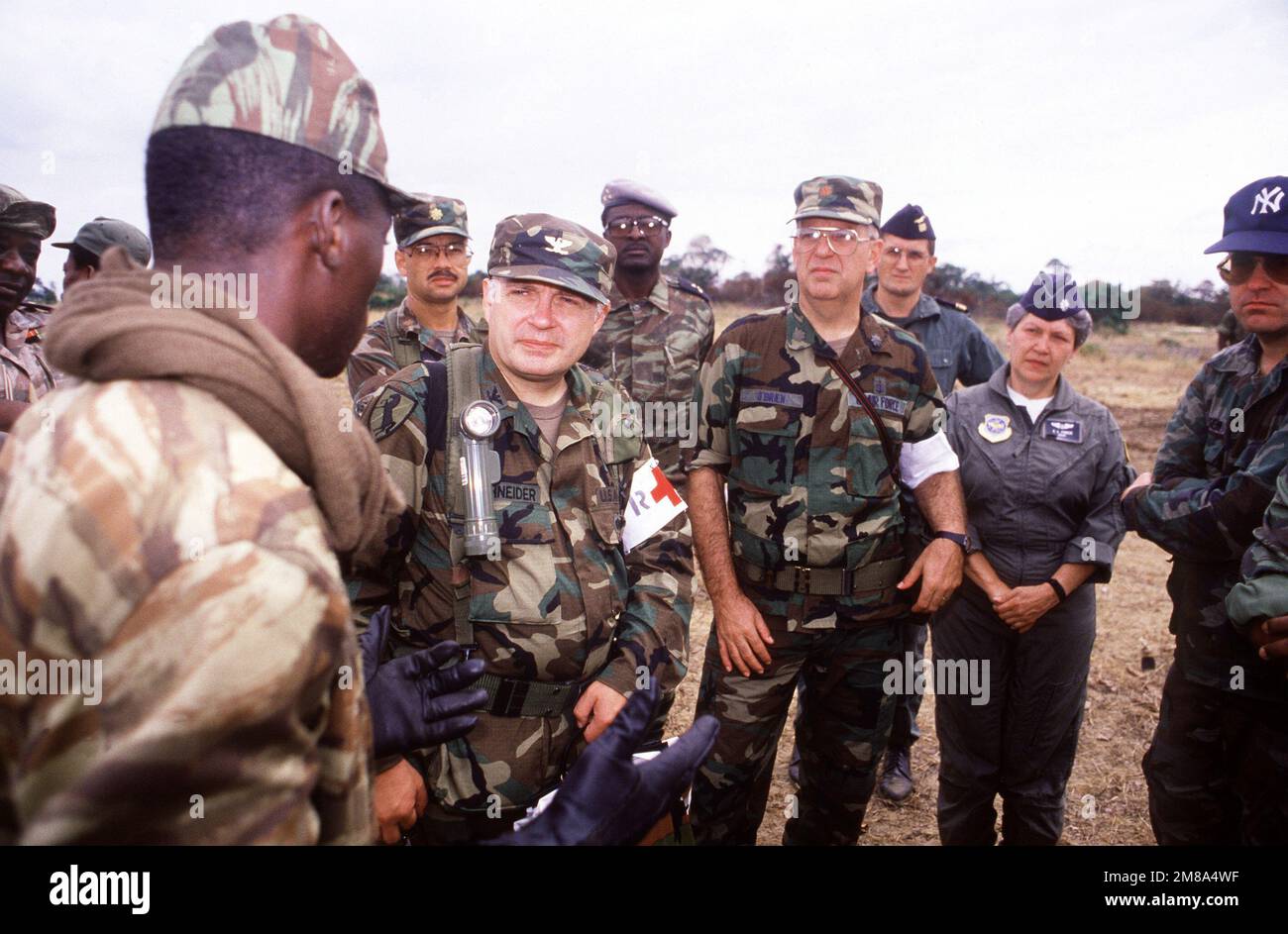 A Gabonese soldier speaks to members of a joint U.S. Army, Navy and Air ...