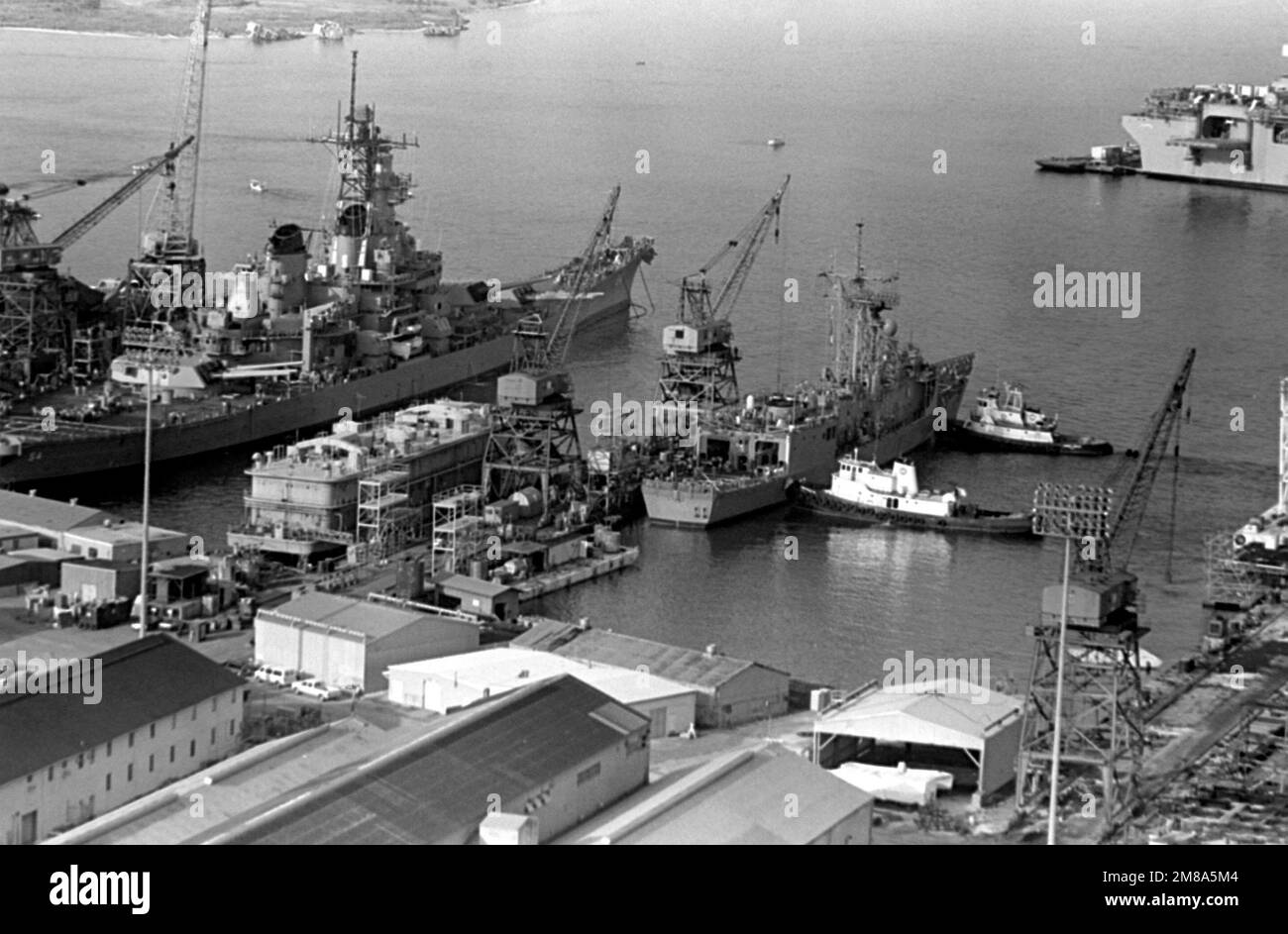 Harbor tugs maneuver the guided missile frigate USS STARK (FFG-31 ...