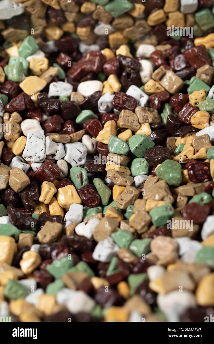 Heap shaped pebble chocolate. Stone-shaped chocolate with a sugar ...