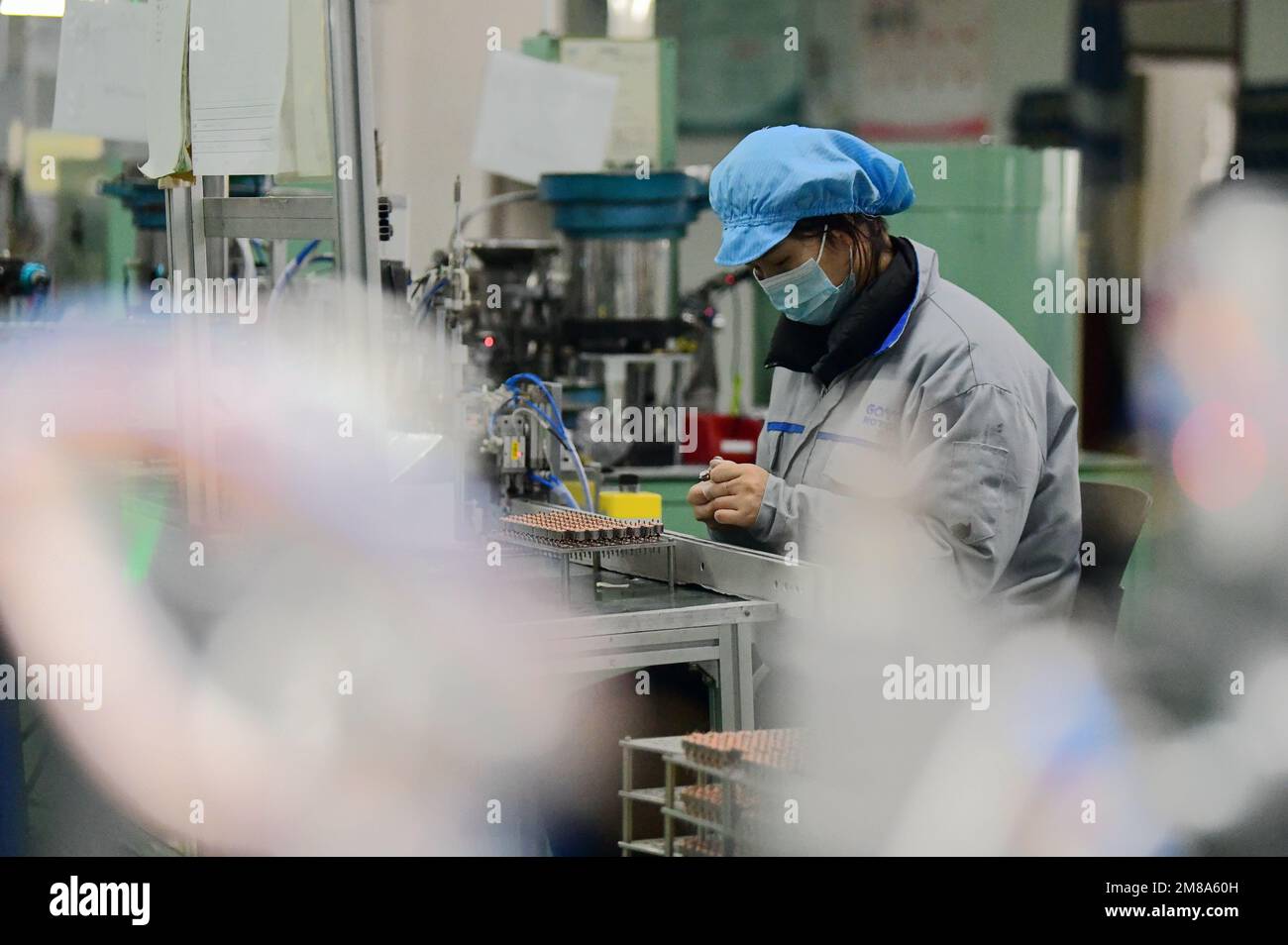 HAI'AN, CHINA - JANUARY 13, 2023 - Workers make miniature DC motors on ...