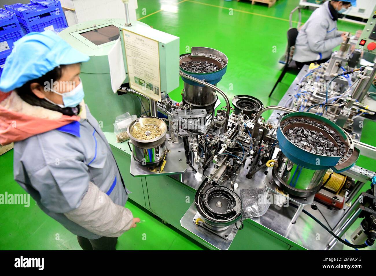 HAI'AN, CHINA - JANUARY 13, 2023 - Workers make miniature DC motors on ...