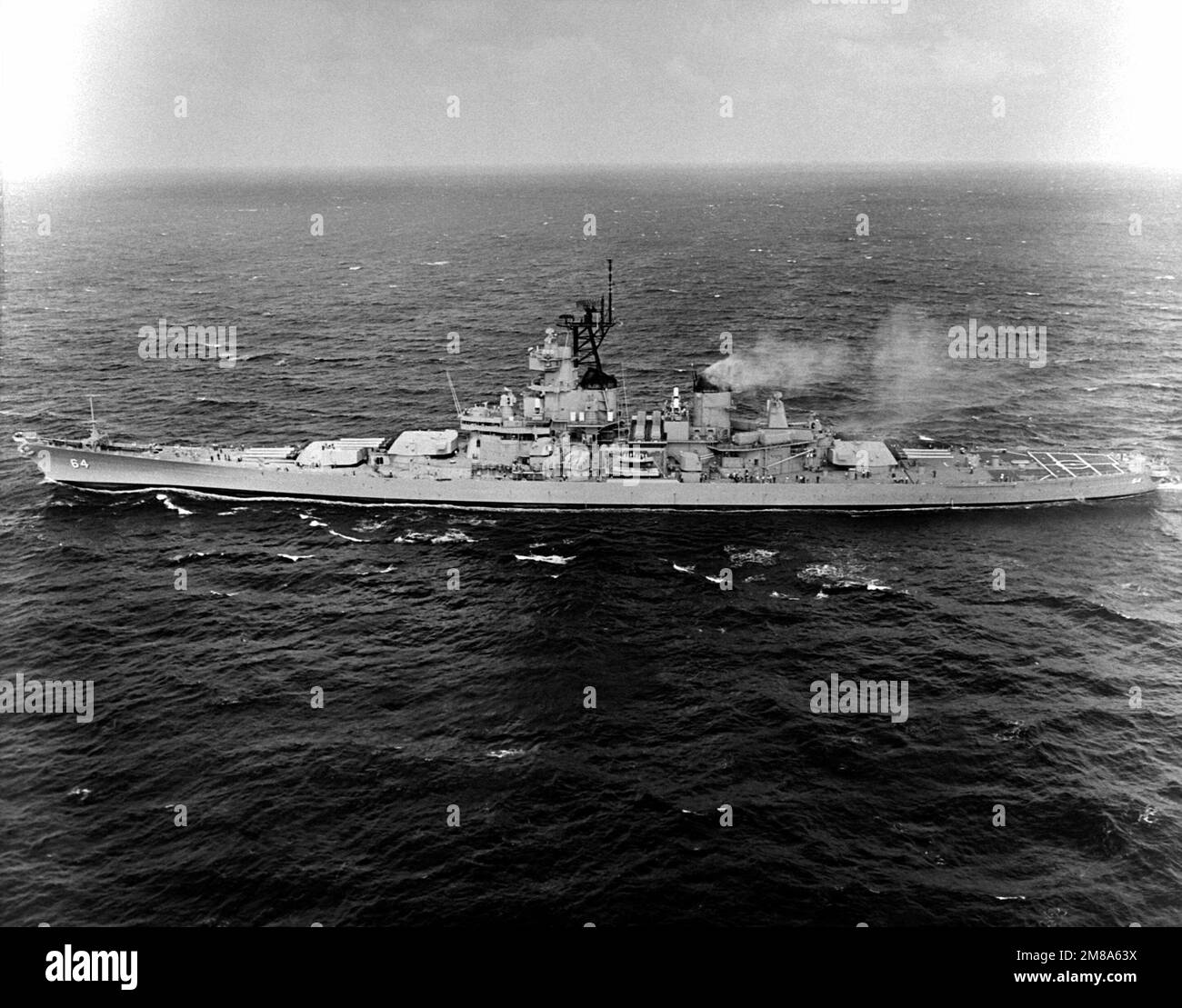 A port beam view of the battleship WISCONSIN (BB-64 underway during sea ...