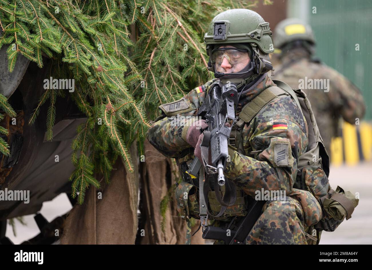 Marienberg, Germany. 12th Jan, 2023. An armored infantryman squats with ...