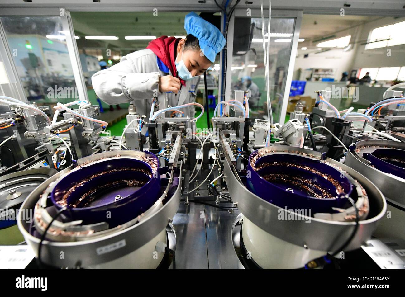 HAI'AN, CHINA - JANUARY 13, 2023 - Workers make miniature DC motors on ...