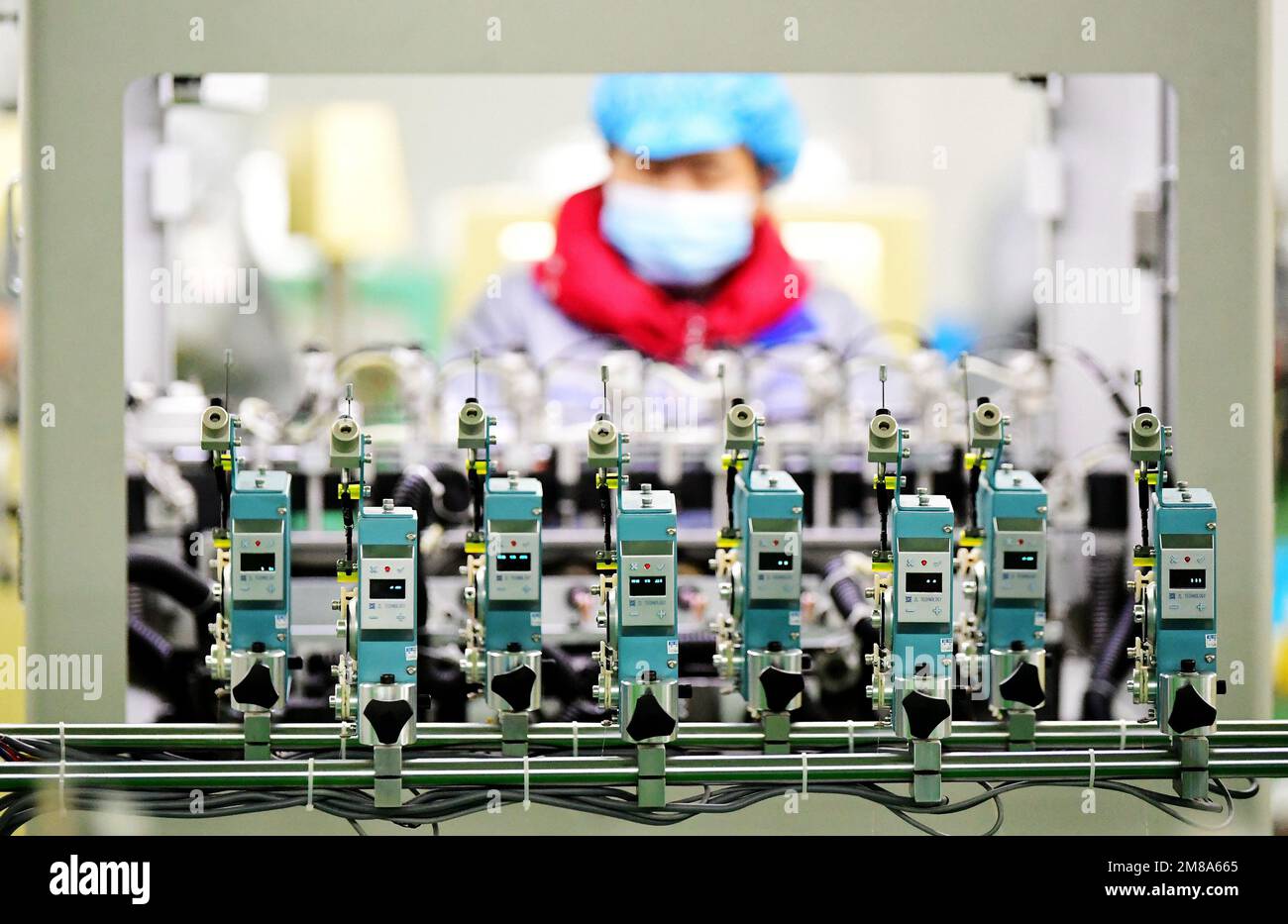 HAI'AN, CHINA - JANUARY 13, 2023 - Workers make miniature DC motors on ...