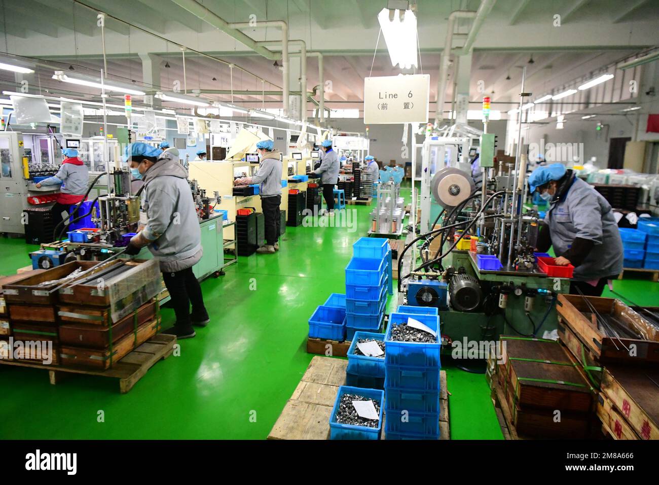 HAI'AN, CHINA - JANUARY 13, 2023 - Workers make miniature DC motors on ...