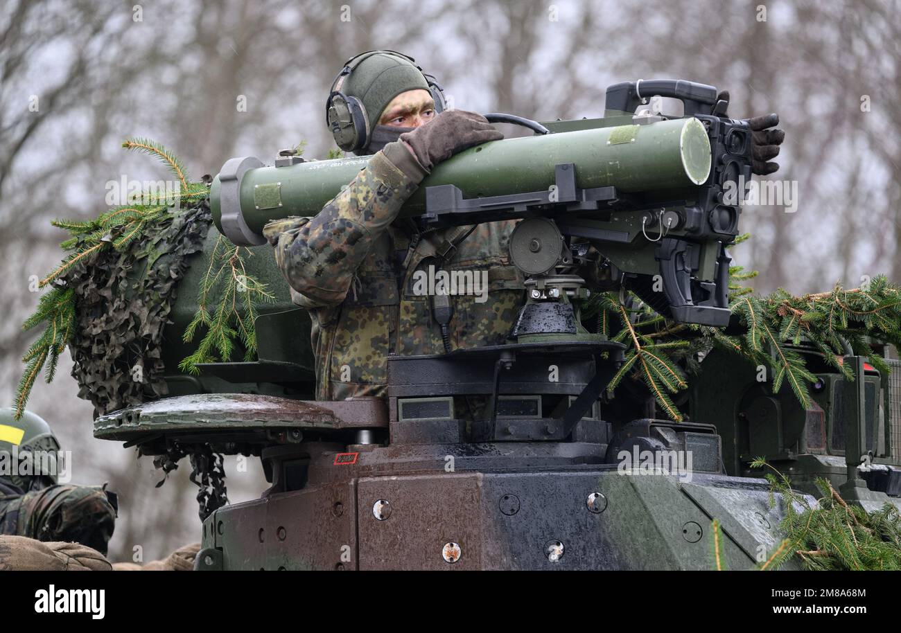 Marienberg, Germany. 12th Jan, 2023. An armored infantryman mounts a ...