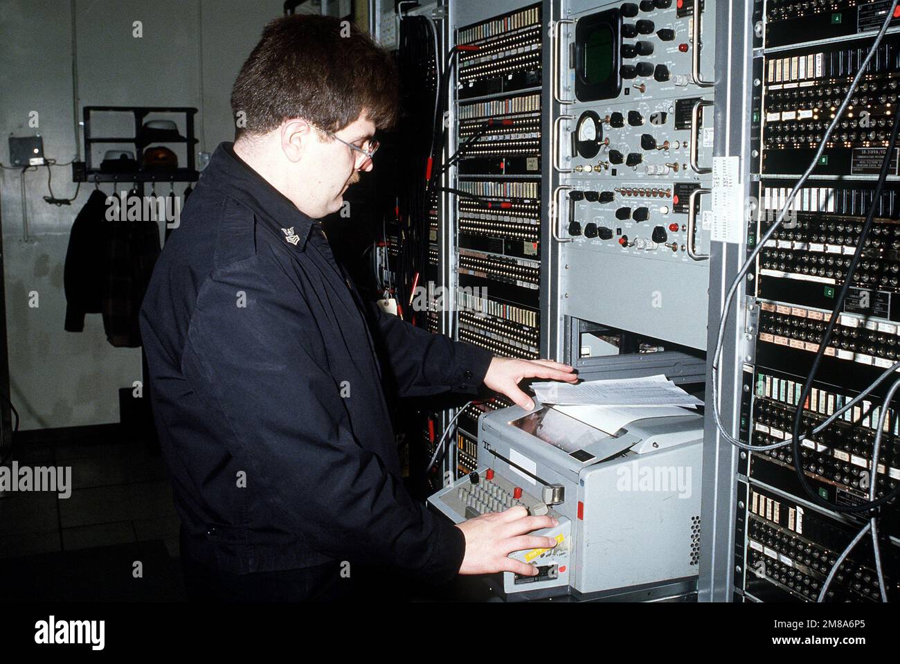 Radioman 1ST Class Maroney uses a teletype machine in the Technical ...