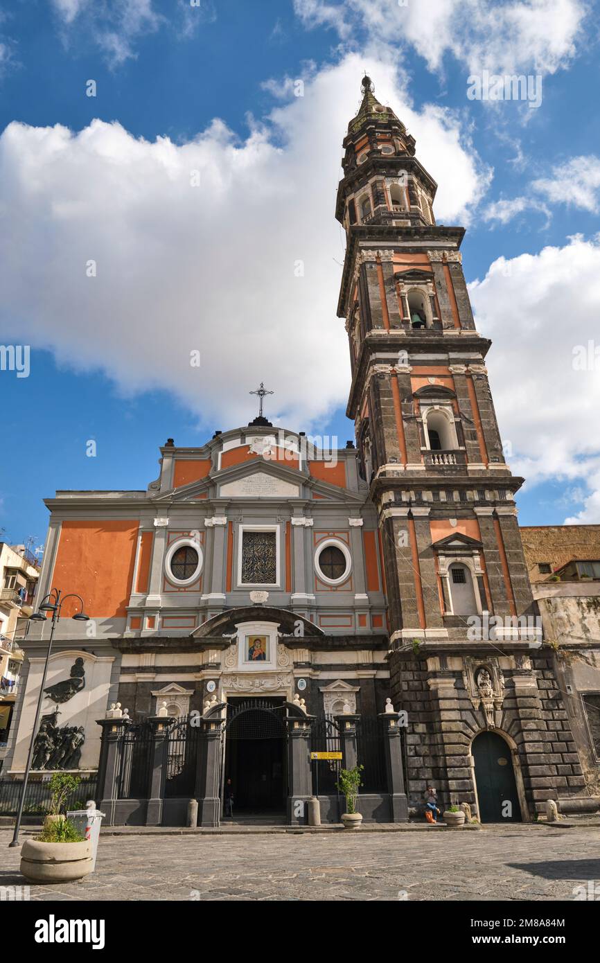 Exterior facade and tall steeple of the Baroque Catholic church ...