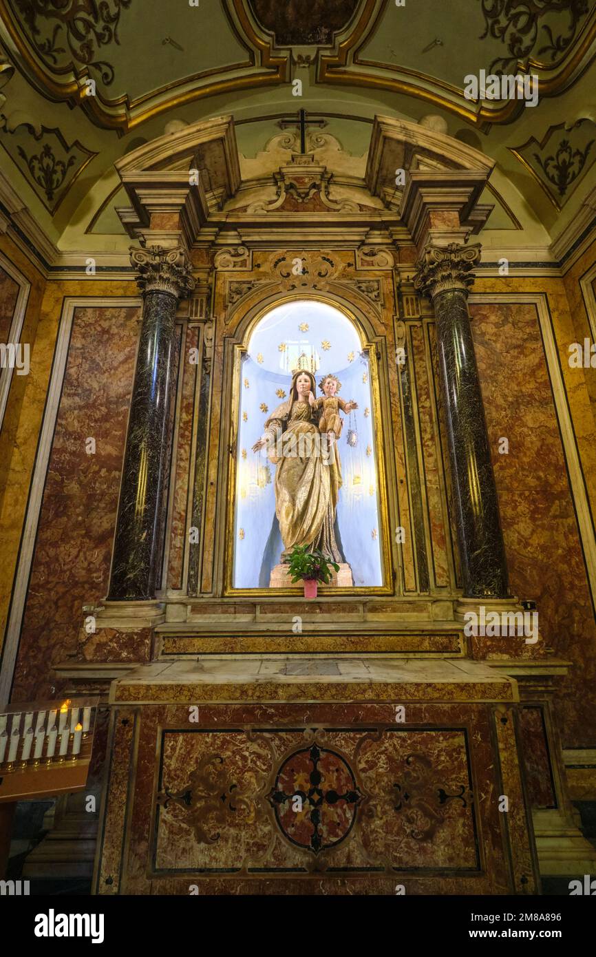 One of the Virgin Mary with the baby Jesus sculptures in a side area at ...