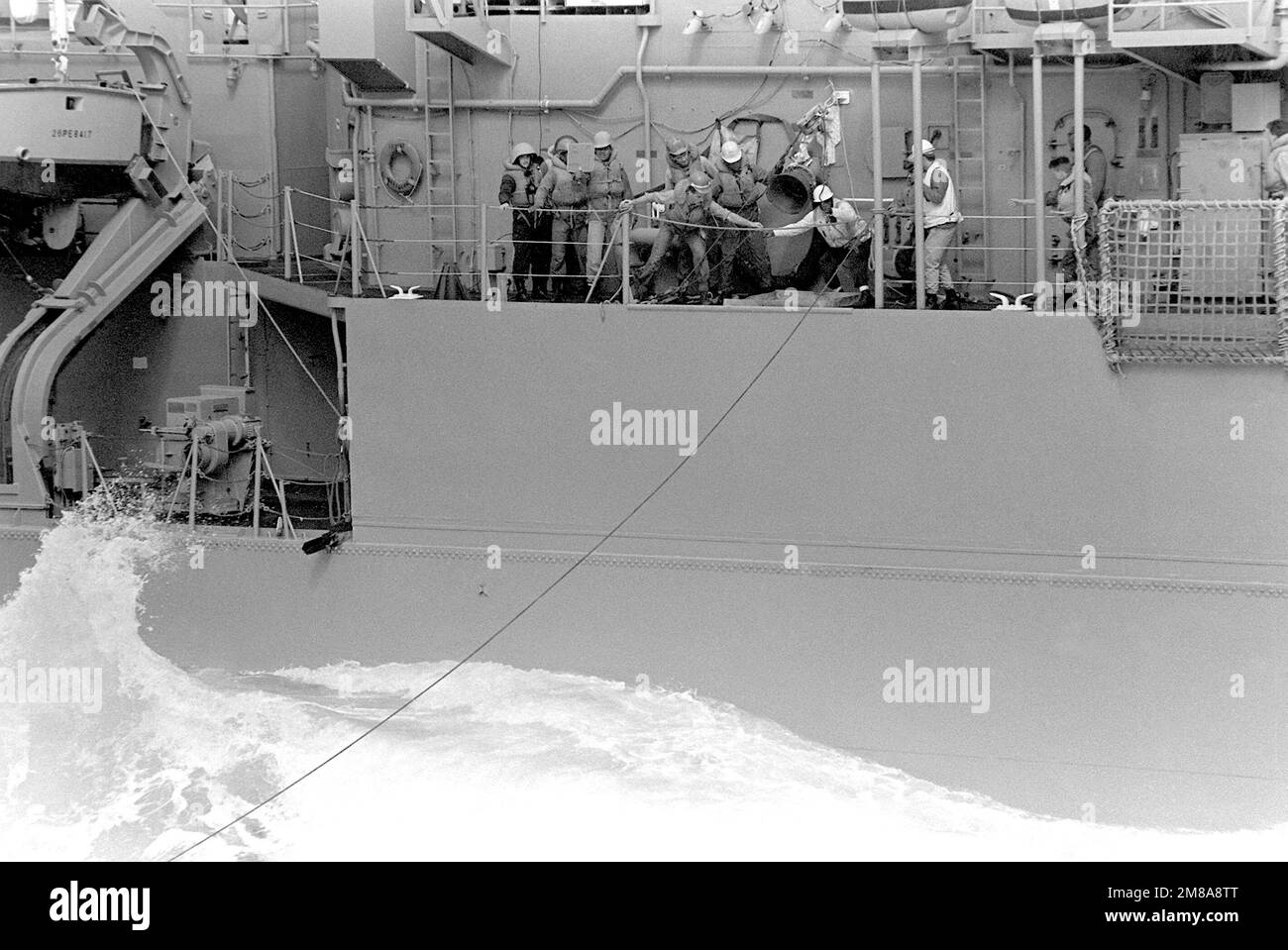 Crewmen at an underway replenishment station aboard the frigate USS ...