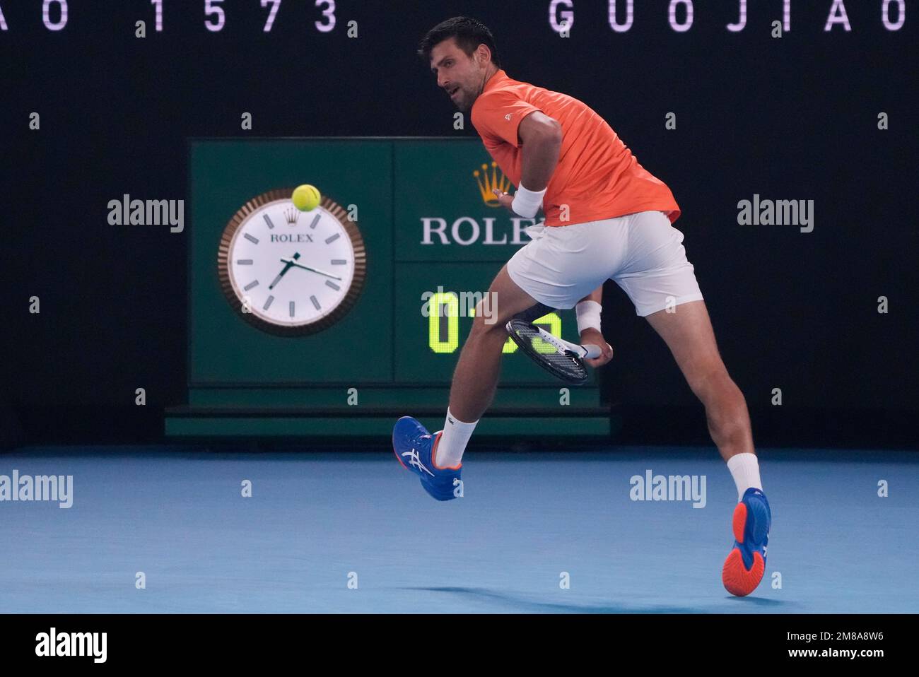 Serbia's Novak Djokovic plays a shot back between his legs during an ...